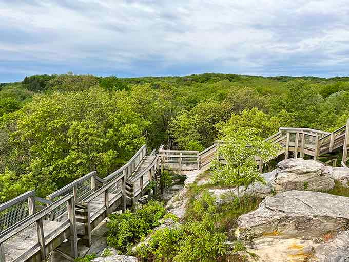 Wooden walkways zigzag across white limestone outcrops, guiding visitors through a landscape that feels almost lunar in appearance.