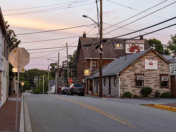 Chesapeake City greets you with a cozy, golden hour glow over the historic Tap Room and its charming, quiet street.