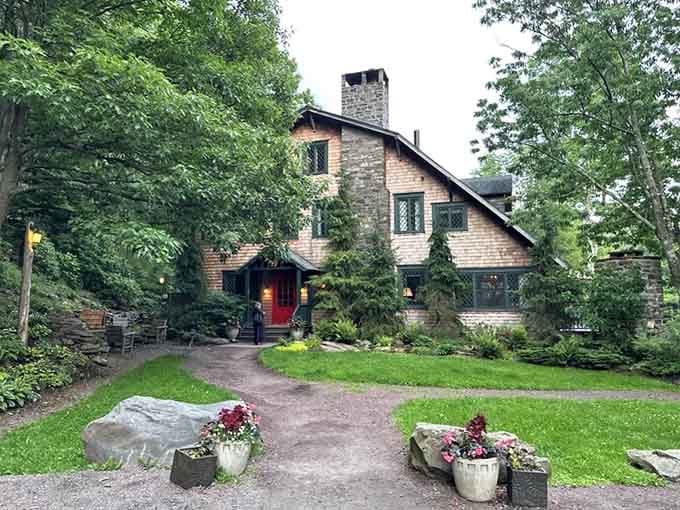 This rustic mountain lodge wrapped in greenery looks like where Snow White's dwarfs would vacation after winning the lottery.