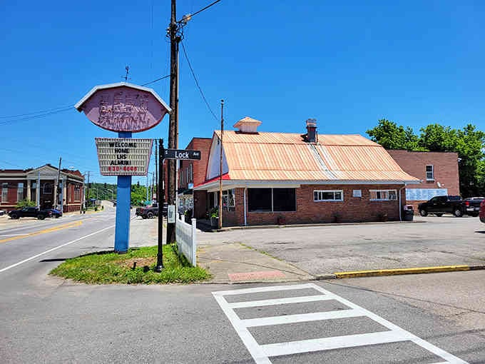 That vintage pink sign stands as a beacon of nostalgia, calling you back to simpler dining days.
