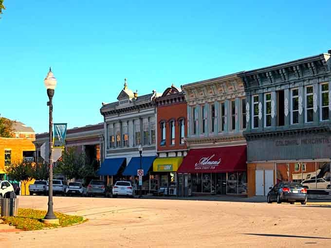 Morning shadows stretch across downtown where every building has earned its place through decades of community service.