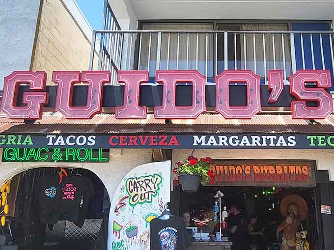 Those hot pink letters spelling "Guido's" shine brighter than a Vegas marquee and twice as inviting for beachgoers.