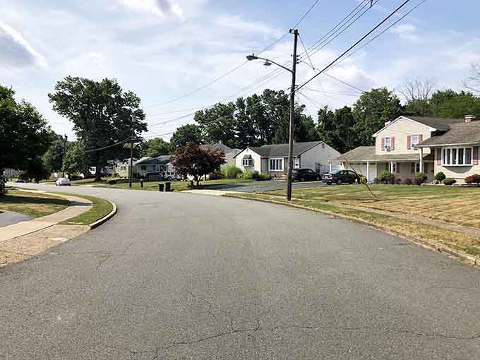 This gentle curve of suburban tranquility shows where neighbors still borrow sugar and remember your kids' names.