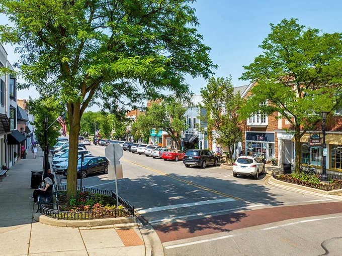 Tree-lined streets create natural canopies over parked cars, where thoughtful landscaping transforms ordinary blocks into peaceful residential retreats.
