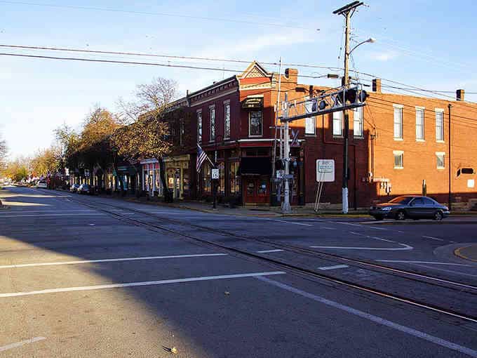 Historic brick buildings anchor this downtown corner where trains still rumble through, keeping tradition alive and well.