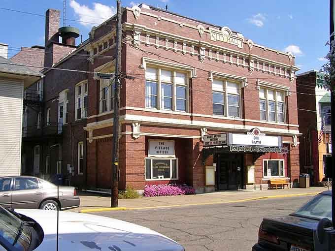 The old theater marquee and brick facades create a streetscape that Hollywood set designers try desperately to recreate.
