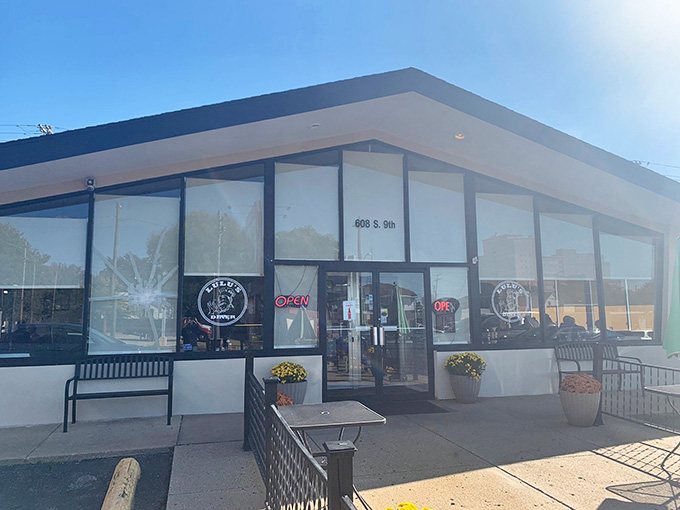 Bright sunshine illuminates a modern facade where traditional diner values meet updated style with impressive results and charm.