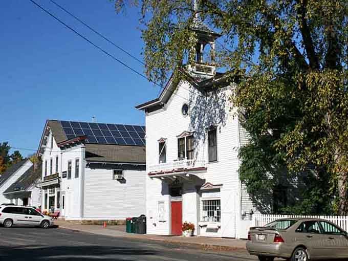 The old firehouse bell tower and bright red door stand as proud reminders of when every building had real character.