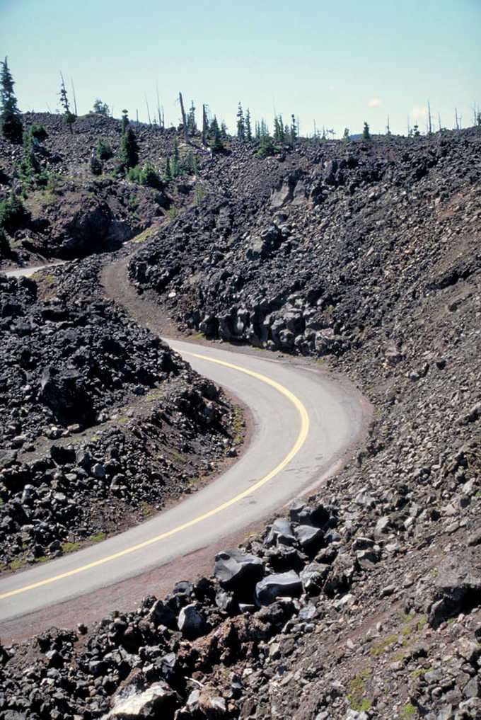 Black lava rock surrounds the road in a moonscape that looks like the set of every sci-fi movie ever made.