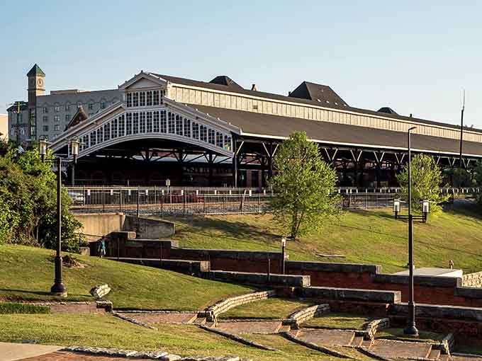 The massive train shed's iron framework creates cathedral-like spaces that protected locomotives and passengers from Alabama weather.