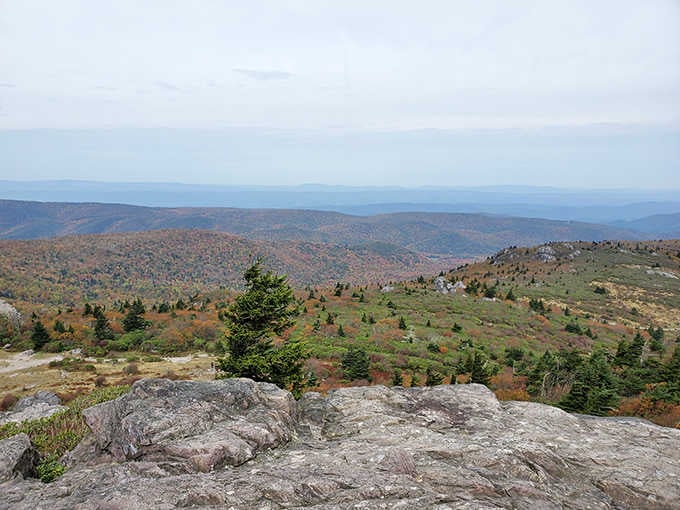 Mountain vistas stretch endlessly across rolling peaks, rewarding hikers with views that make every step of the climb worthwhile.