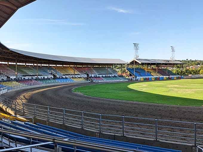The classic wooden grandstand curves around the arena where cowboys have competed for over a century.