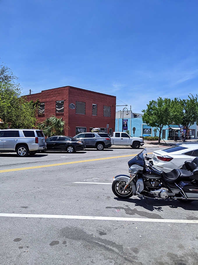 Classic brick storefronts and parked pickup trucks create a scene that could be from any decade you choose.