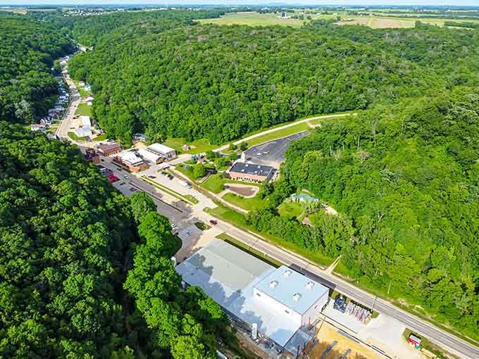 Lush forests embrace this riverside community, creating a natural buffer between modern life and timeless small-town tranquility.