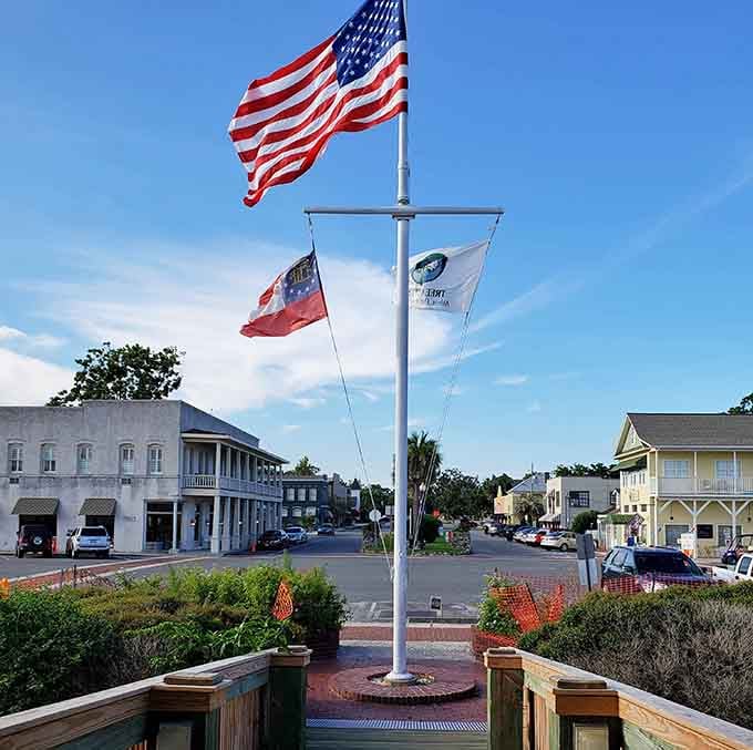Three flags flying proud against blue skies remind you that some traditions are worth keeping alive and celebrating.