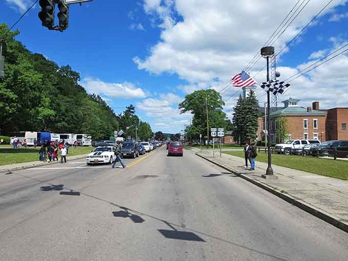 Wide main street stretches toward distant trees, inviting an unhurried stroll that your fitness tracker won't understand but you will.