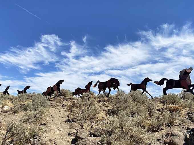 Steel horses thunder across the hilltop in eternal motion, their silhouettes capturing the untamed spirit of Washington's high desert.