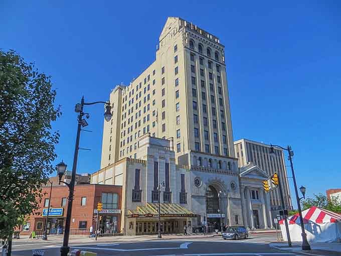 This grand Art Deco tower stands tall against blue sky, looking like something Gotham City would envy for its dramatic architectural presence.