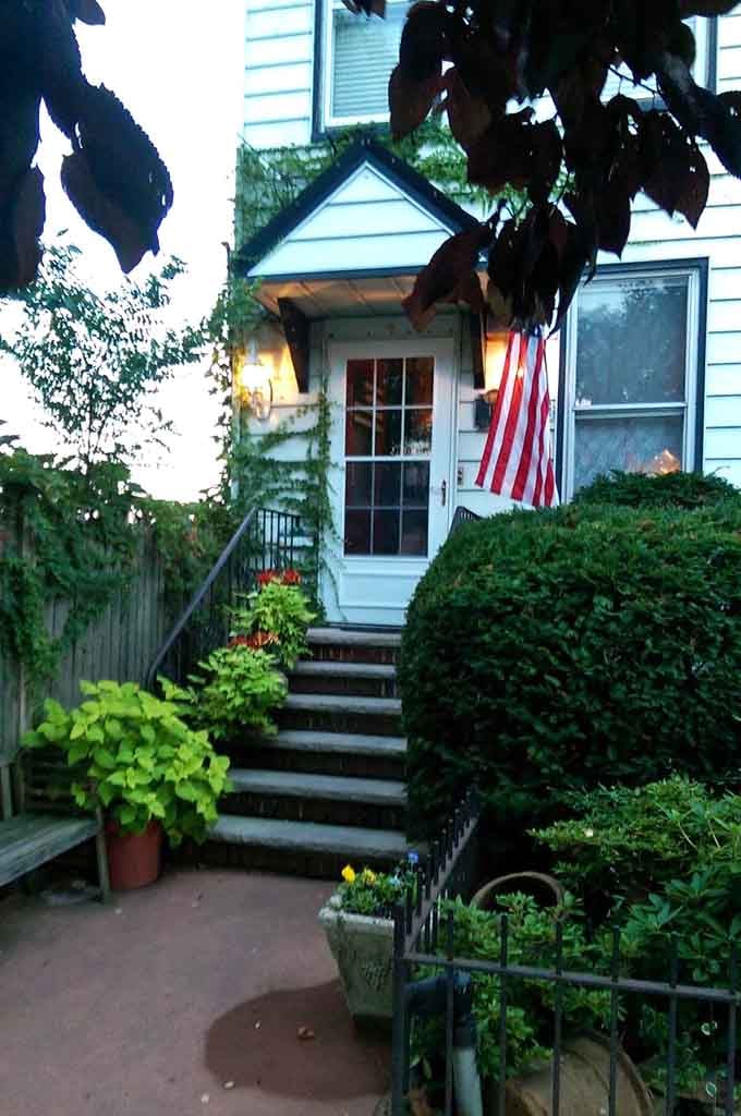 When the American flag waves and the garden blooms, you know something special awaits beyond that door.