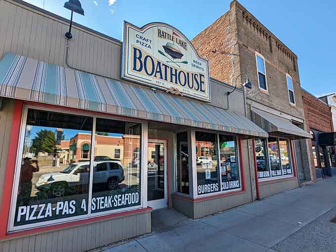 The Battle Lake Boathouse sign promises craft pizza, cold beer, and good spirits, which sounds like the perfect post-paddle reward to me.