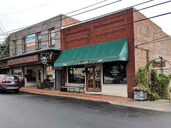 Green awnings and brick facades create the kind of Main Street America where Andy Griffith would feel right at home.