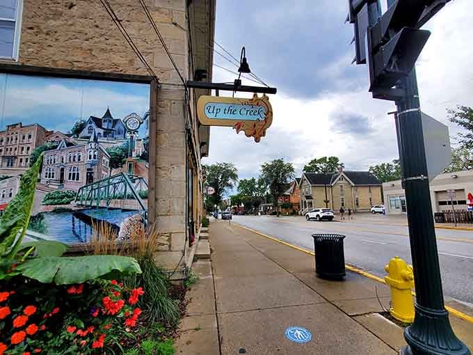 Colorful murals and cheerful planters transform ordinary sidewalks into an outdoor art gallery worth strolling through twice.