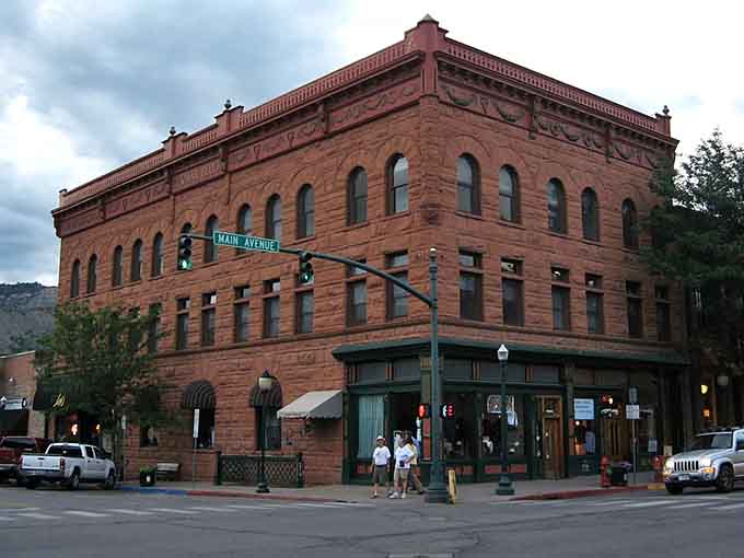 Evening light softens the historic downtown where mountain peaks provide the backdrop and local shops provide the soul.