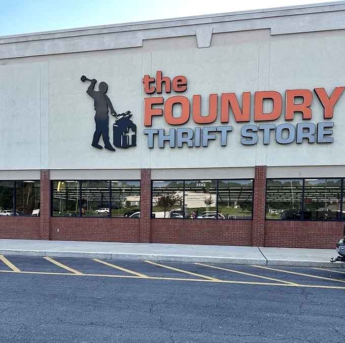 The orange and gray color scheme pops against the brick, announcing a thrift store with serious style.