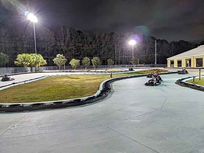 Evening lights illuminate the smooth curves of this outdoor track, perfect for after-dinner racing adventures.