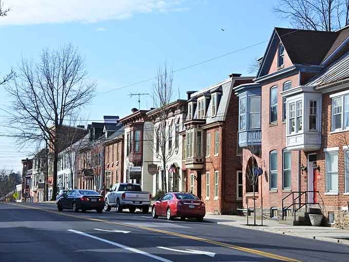 Row houses line up like colorful dominoes, each one adding its own personality to this charming streetscape.
