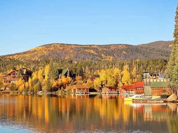 Fall colors explode across the water's surface, doubling the beauty in reflections that look almost too perfect.