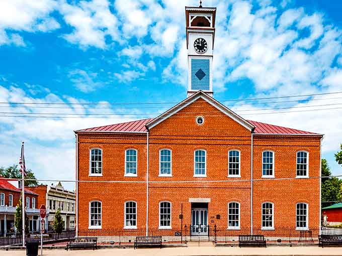 That clock tower stands like a patient grandfather, keeping time while the world rushes past below.