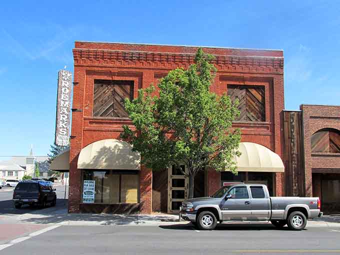 Brick buildings stand shoulder to shoulder like old companions who've weathered every economic storm together and kept standing.