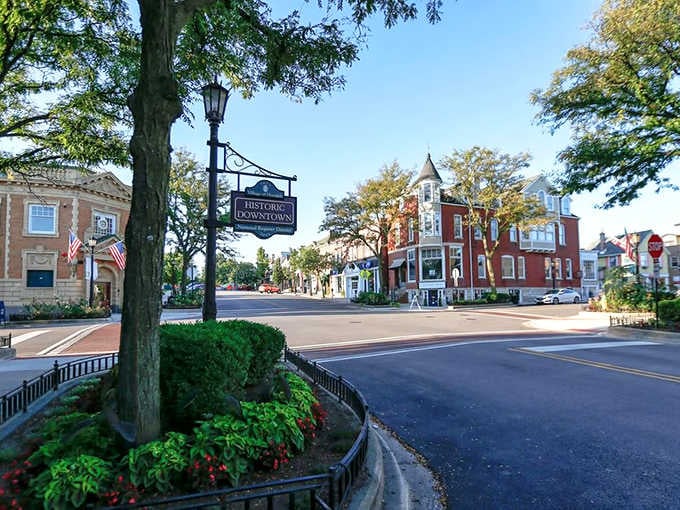 The "Historic Downtown" sign welcomes visitors to tree-shaded streets where Victorian buildings house modern shops and timeless community spirit.