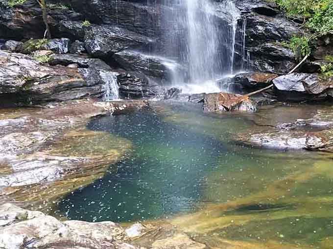 This waterfall drops into a pool so clear and inviting, you can practically feel the cool spray.