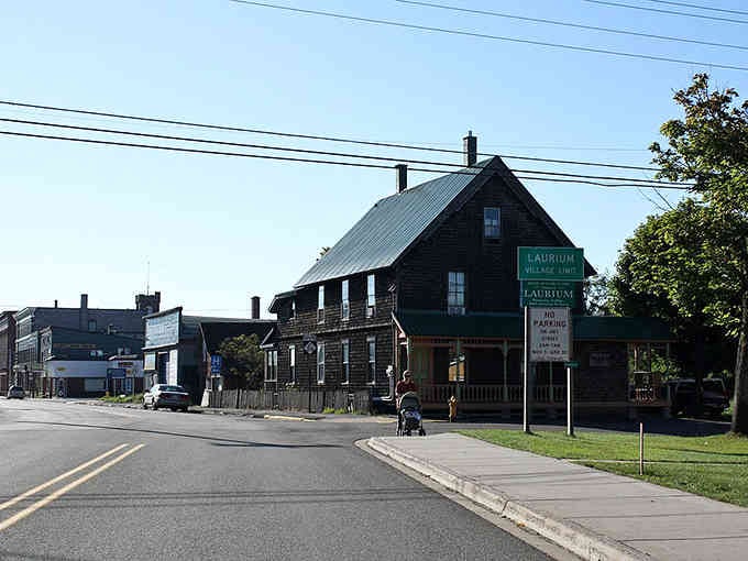 Dark wood siding gives this historic building character that modern construction simply cannot replicate or manufacture convincingly.