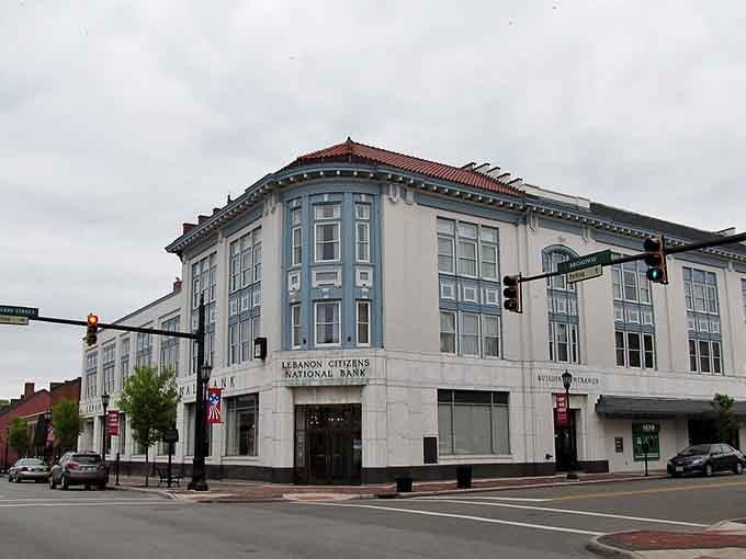 That grand corner bank building commands respect with its elegant stonework, like something from a Jimmy Stewart movie.