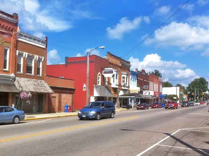 Historic brick buildings stand shoulder to shoulder like old friends who've weathered every storm together for generations.