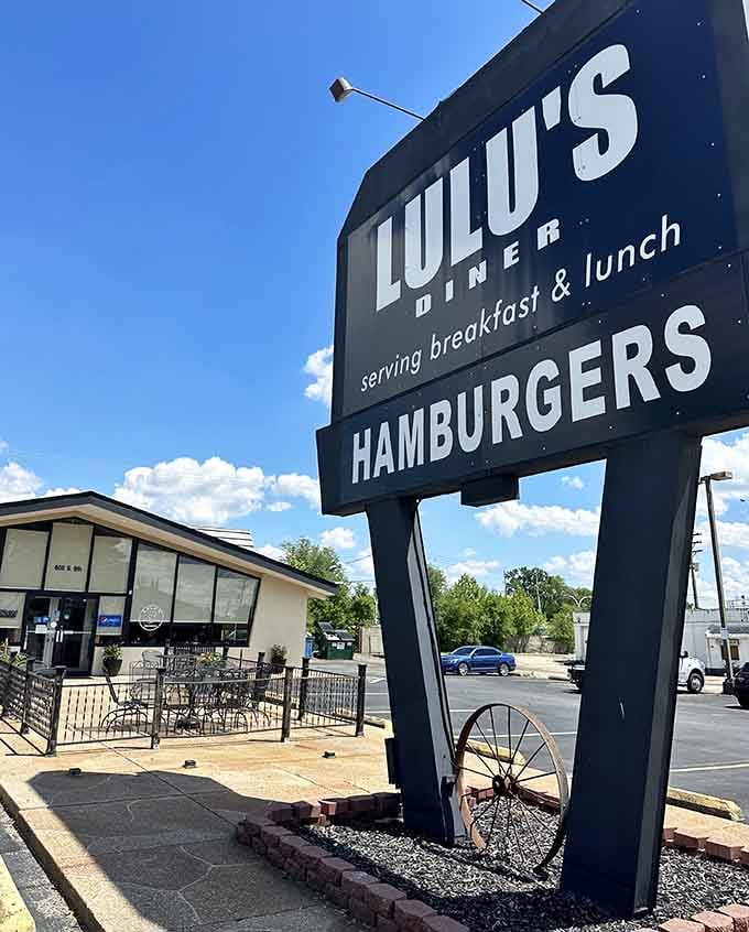 That bold sign against blue sky promises exactly what you need: honest hamburgers and hearty morning meals.