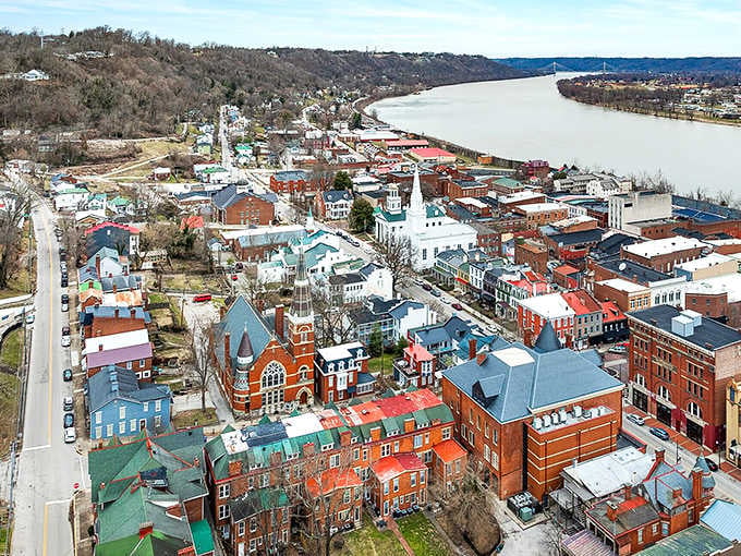 The Ohio River curves majestically past colorful rooftops, creating a vista that's been captivating travelers for centuries.