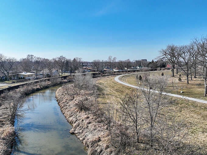 This peaceful waterway winds through town like nature's own Main Street, offering serenity you can't buy at any price.