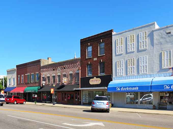 Vintage awnings and varied facades create a streetscape with personality&mdash;each building contributing its own chapter to the town's ongoing story.