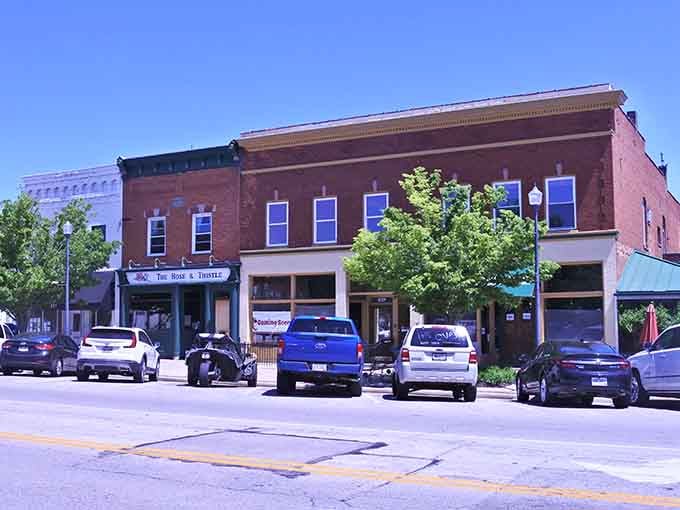 Those brick storefronts under summer skies remind you that some towns refuse to sacrifice charm for convenience.