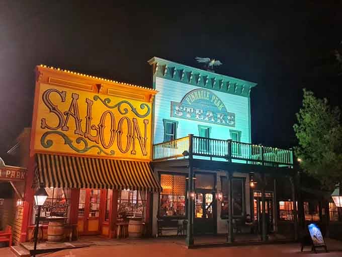 Evening lights illuminate the Old West facades, making dinner feel like stepping onto a movie set.