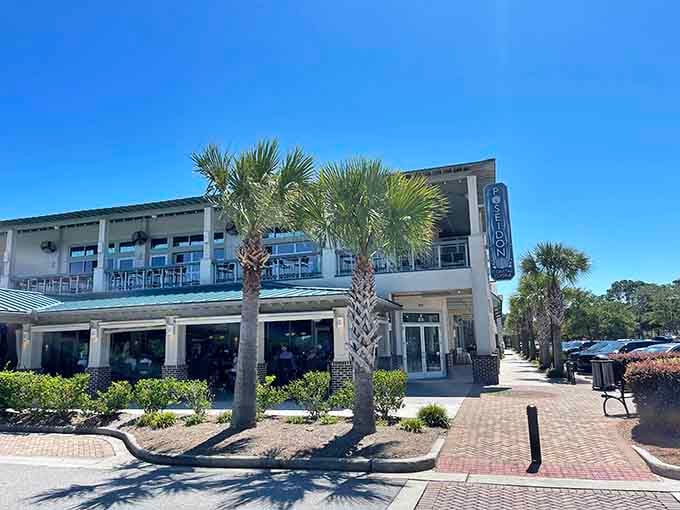 Palm trees and brick pavers frame this elegant seafood destination where the ocean meets sophisticated coastal dining.