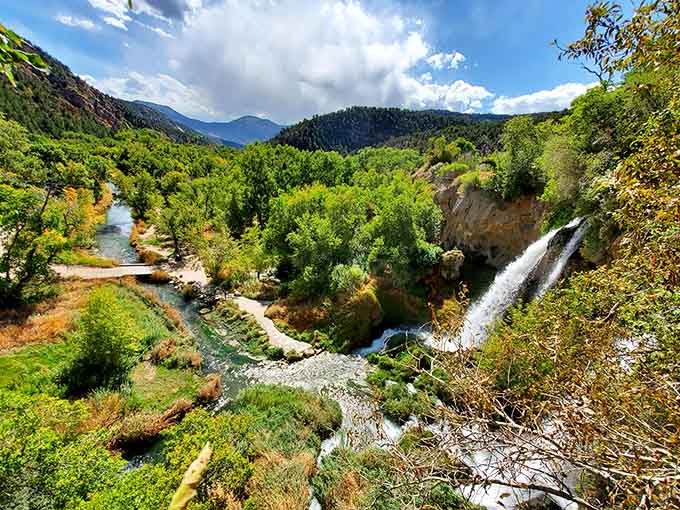 That turquoise pool below catches the falling water, creating a scene worthy of a travel magazine cover.
