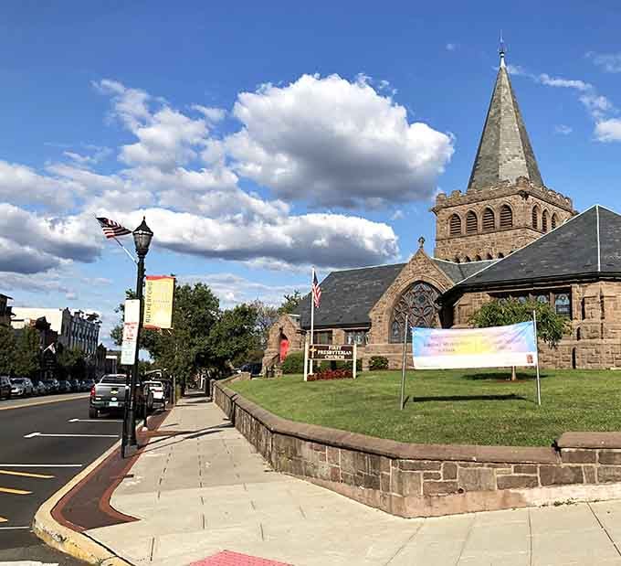 That beautiful stone church anchors a downtown where Sunday brunch is practically a religious experience worth celebrating together.