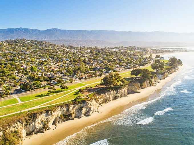 The coastline curves gracefully where cliffs meet sandy beaches, creating a landscape that rivals the French Riviera's best views.
