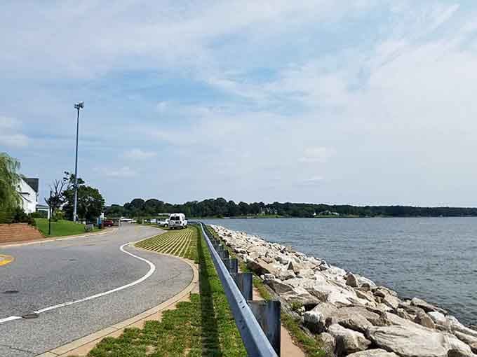 Rocky shoreline curves along the bay where generations have walked, fished, and watched the world go by.