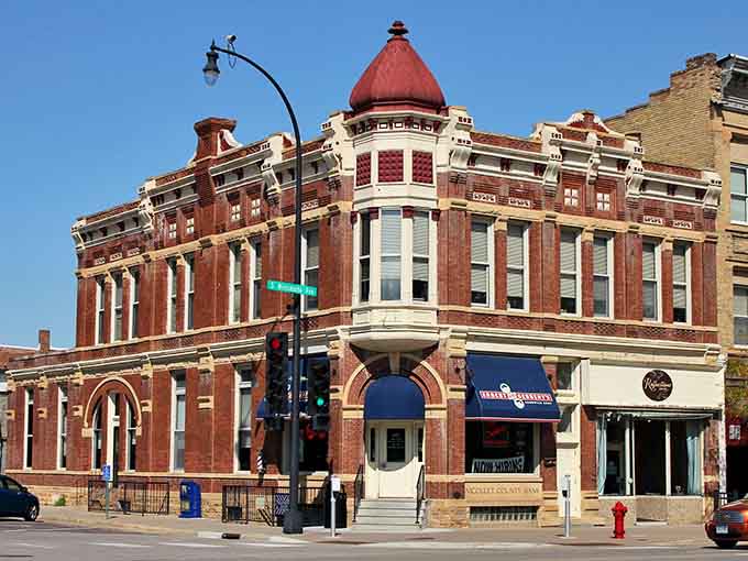 That ornate corner turret and red dome prove they built things with serious personality back in the day.